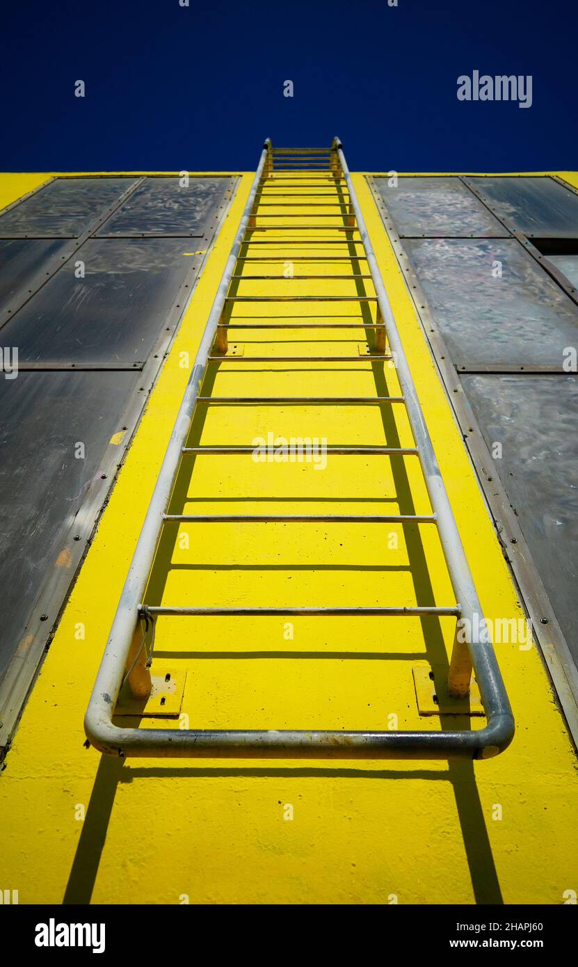 Vintage yellow upstairs ladder background Stock Photo - Alamy