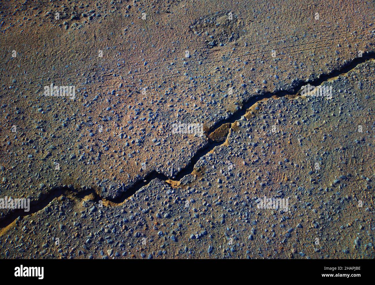 Cracked asphalt road texture background Stock Photo - Alamy