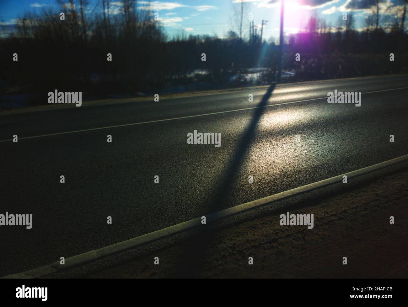 Diagonal light ray on empty road background Stock Photo - Alamy