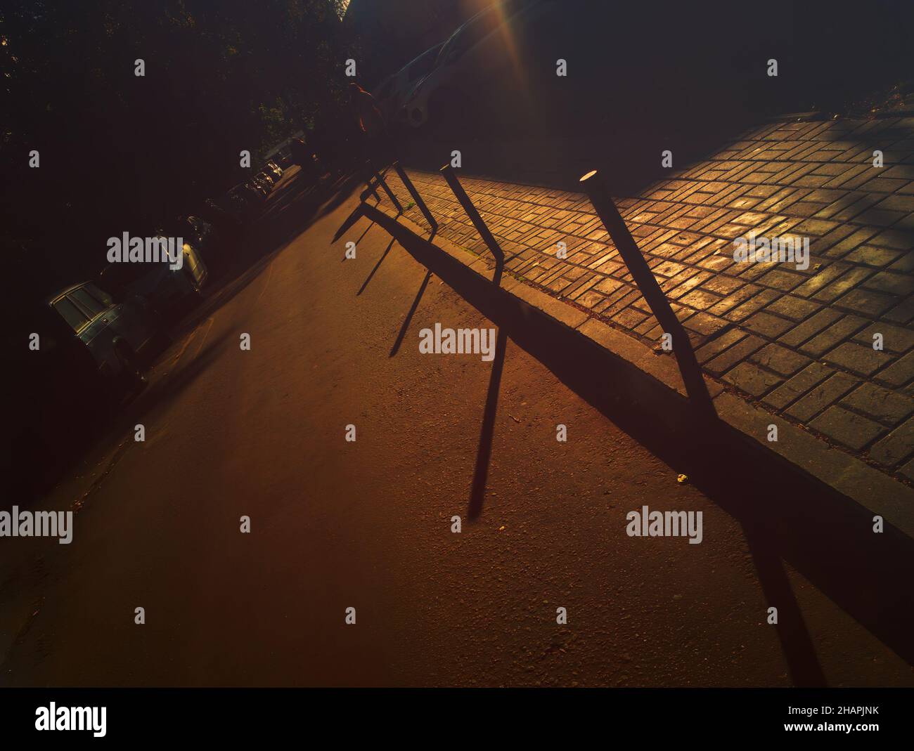 Tilted morning street illuminated by sunshine Stock Photo - Alamy