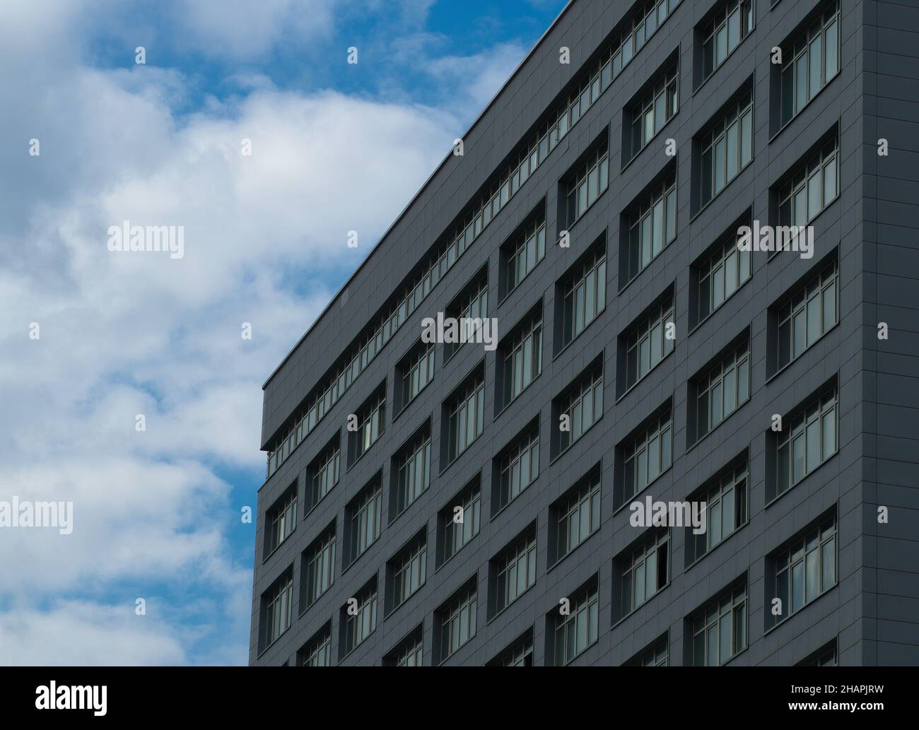 Many-storied office building in perspective background Stock Photo - Alamy