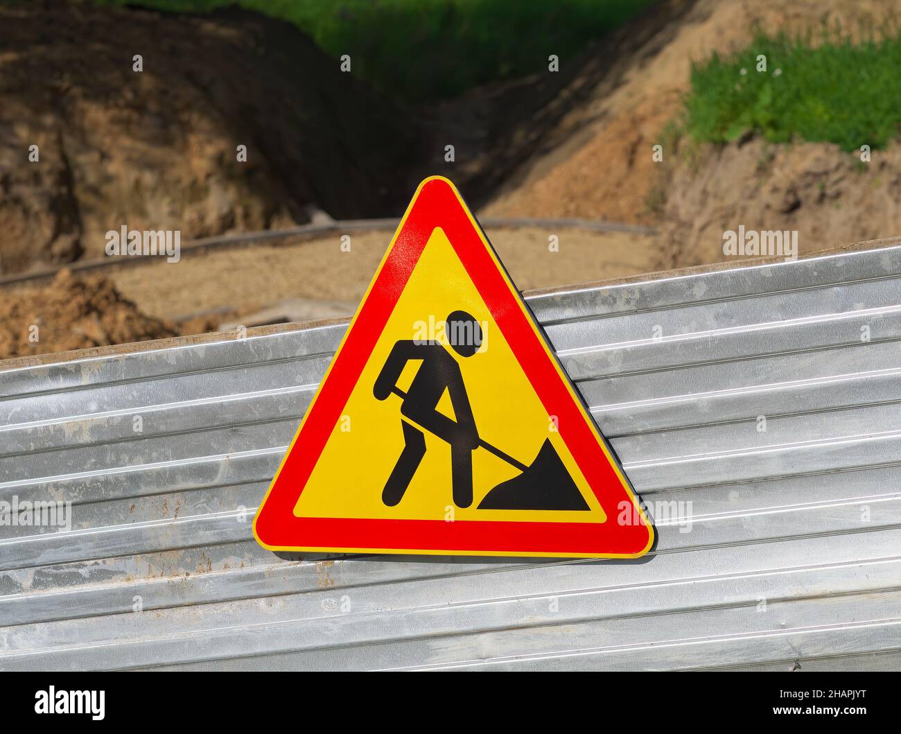 Road is under construction sign background Stock Photo - Alamy