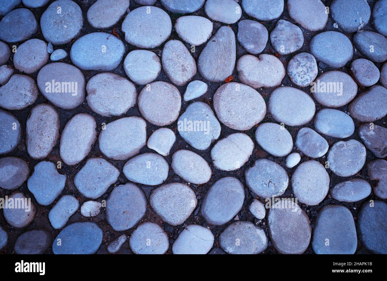Medieval stone pavement texture background Stock Photo - Alamy