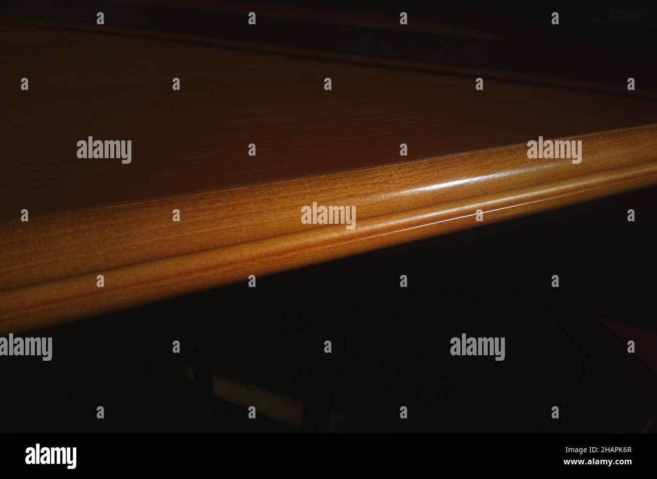 Illuminated border of the wooden table background Stock Photo - Alamy