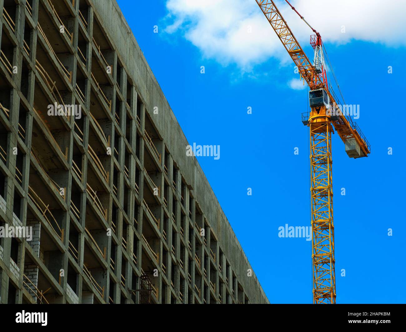Industrial crane at construction site background Stock Photo - Alamy