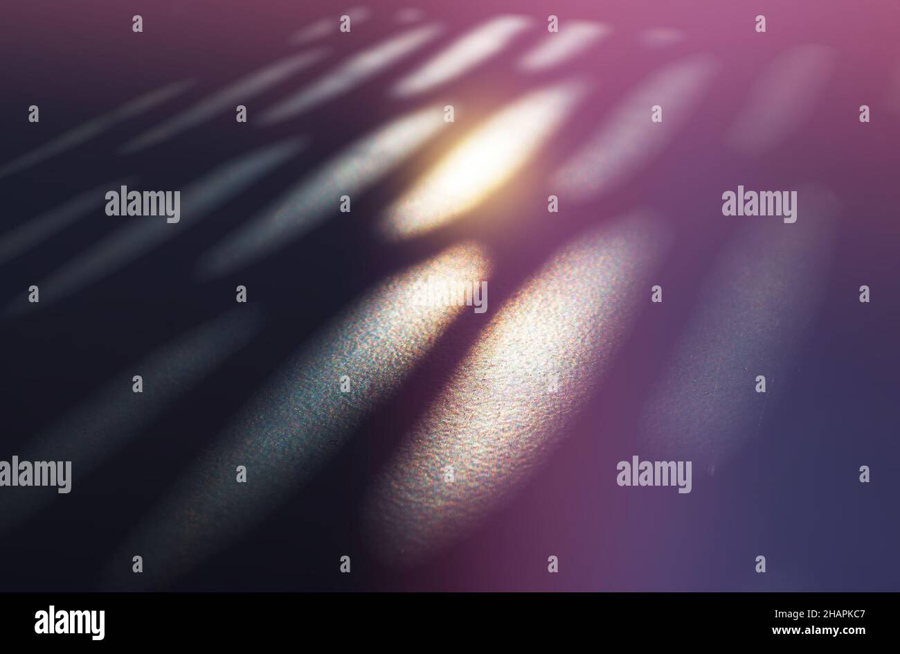 Abstract light leaks from perforated object background Stock Photo - Alamy