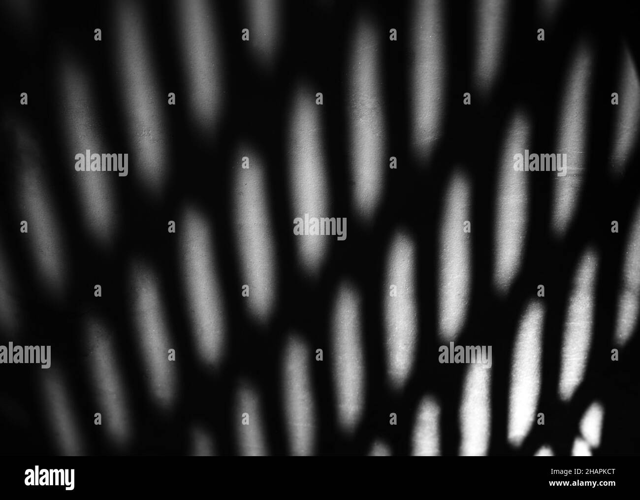 Abstract light leaks coming from perforated object Stock Photo - Alamy