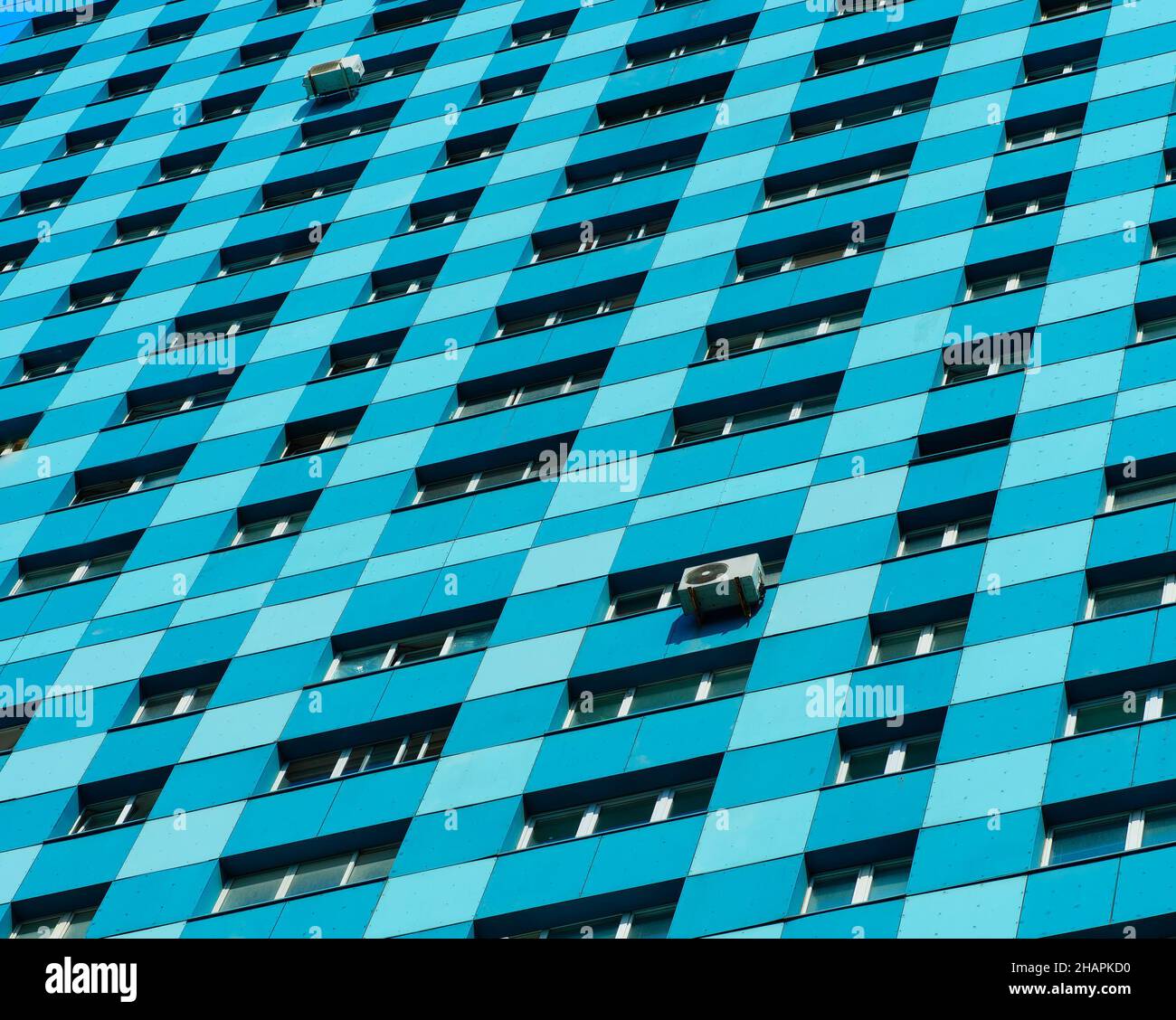 Diagonal windows of aqua building background Stock Photo - Alamy