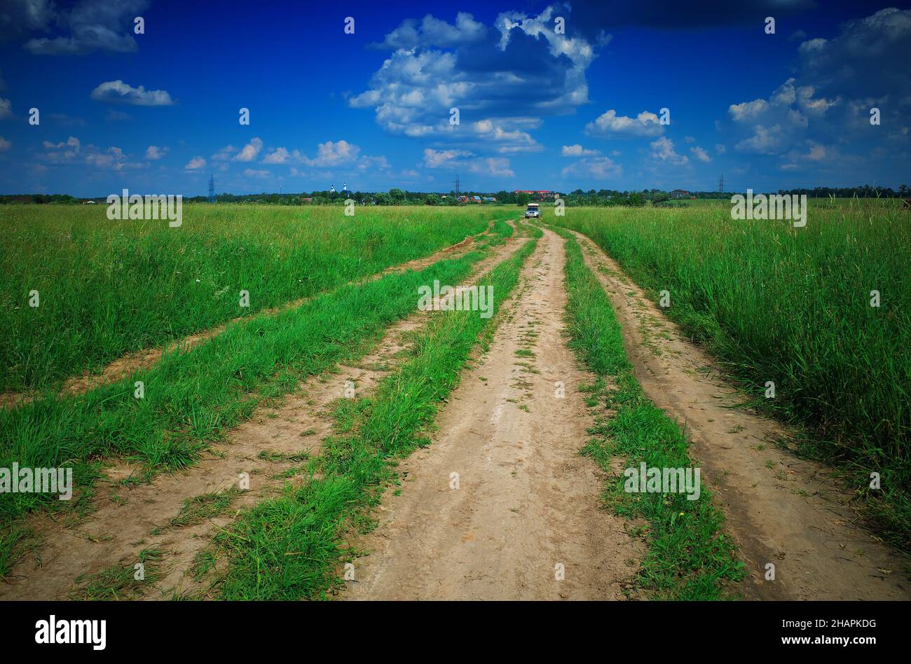 Lonely car on countryside road travel background Stock Photo - Alamy