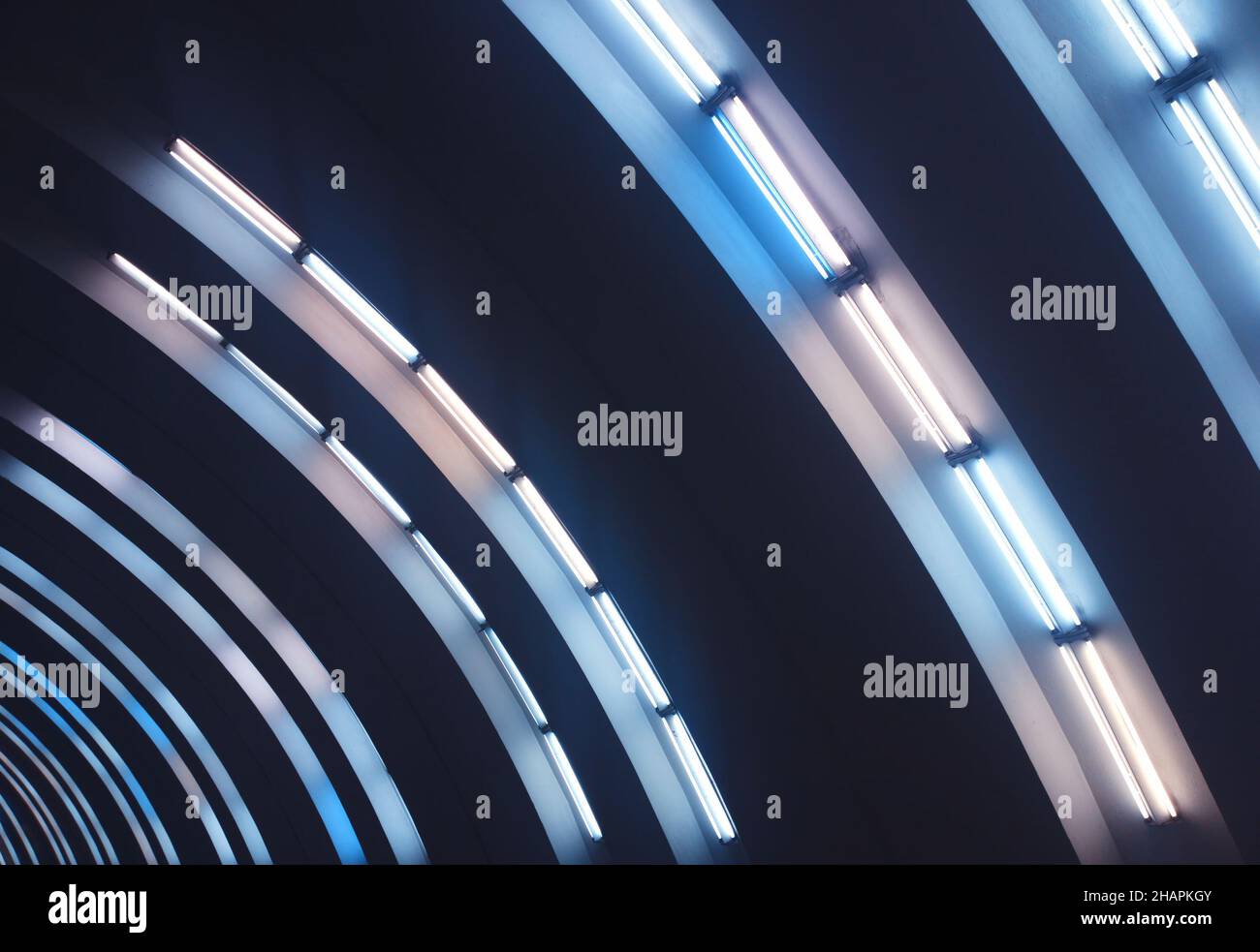 Arc shaped illumination lamps background Stock Photo - Alamy