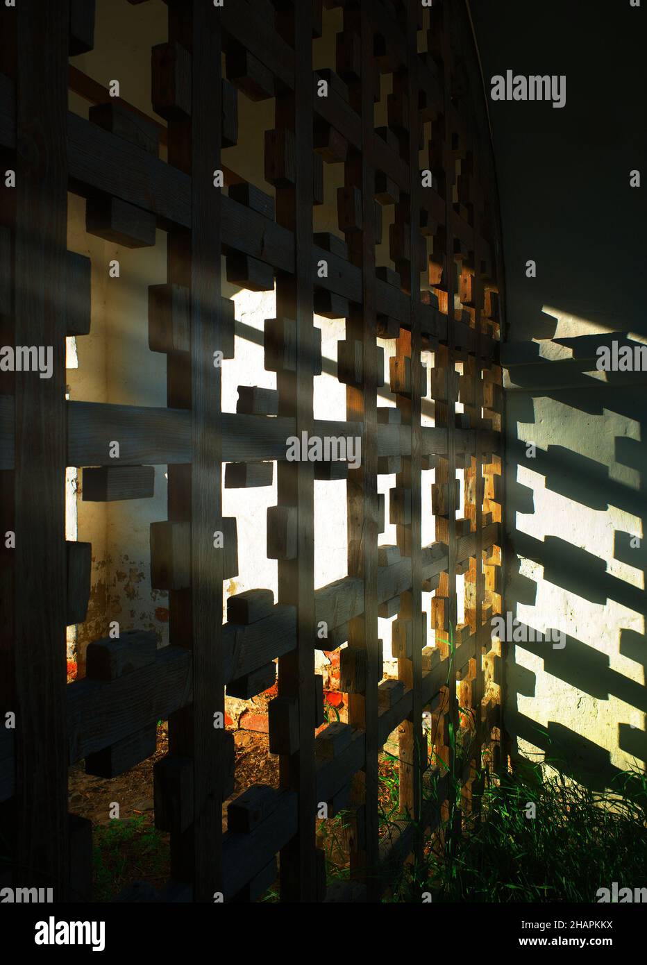 Light rays coming through wooden gate background Stock Photo - Alamy