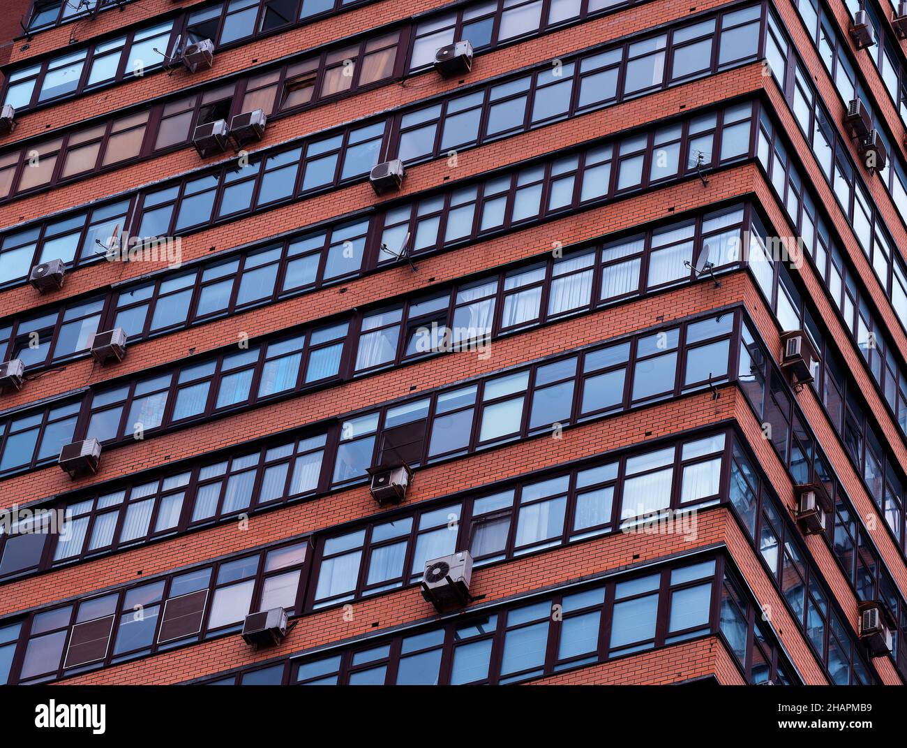 Tilted windows of many-storied building architecture backdrop Stock ...