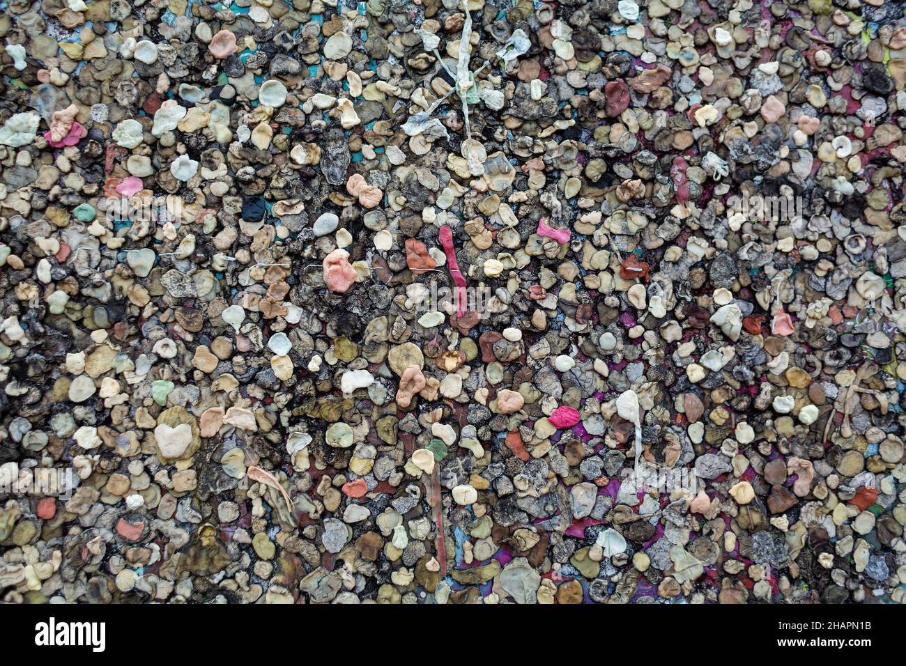 The texture of the landmark Berlin Wall is covered with chewing gum ...
