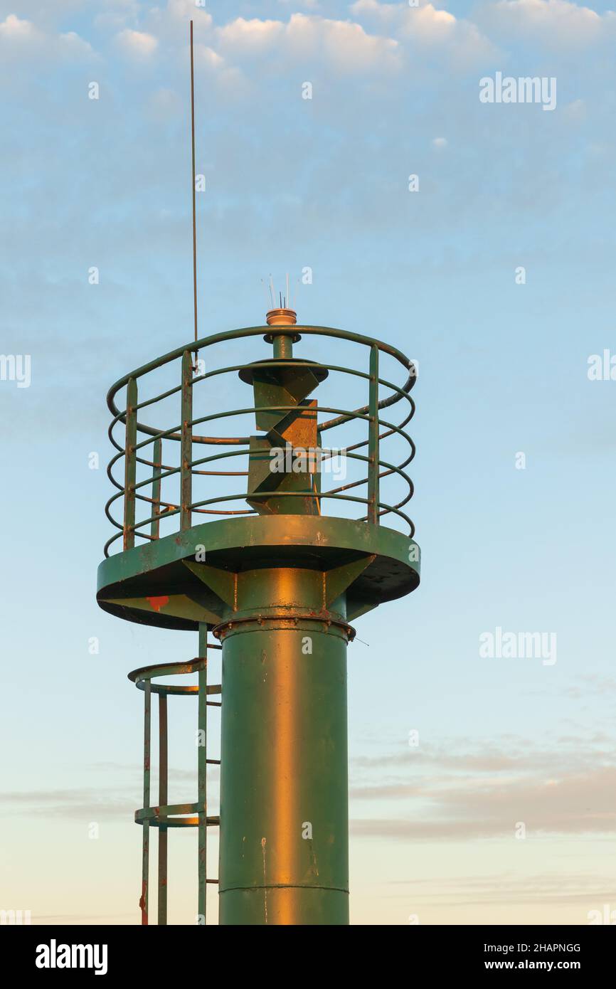 Upper part of a green beacon under blue sky Stock Photo - Alamy