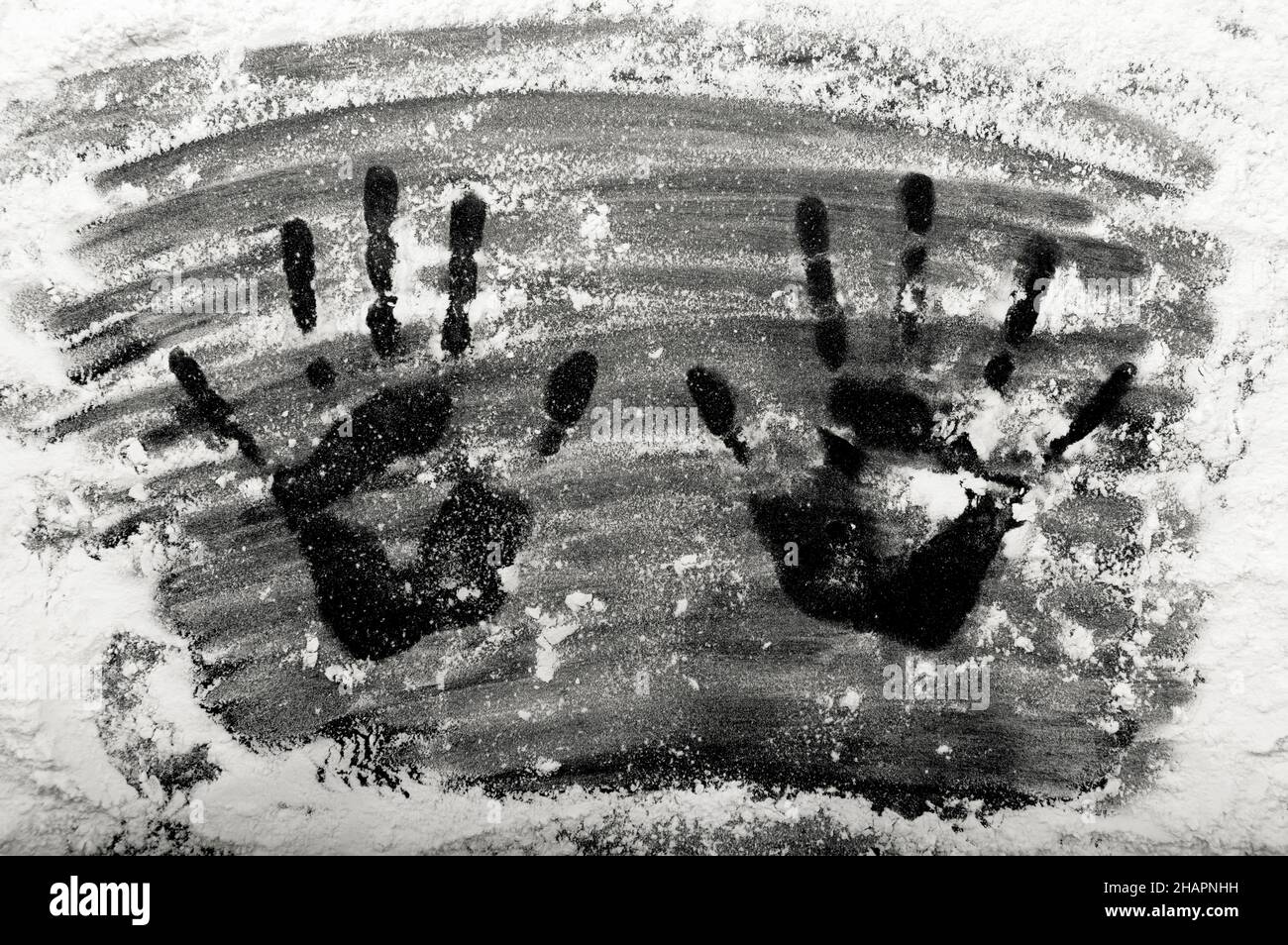 Background made of flour or powder on a black texture. Handprints on ...