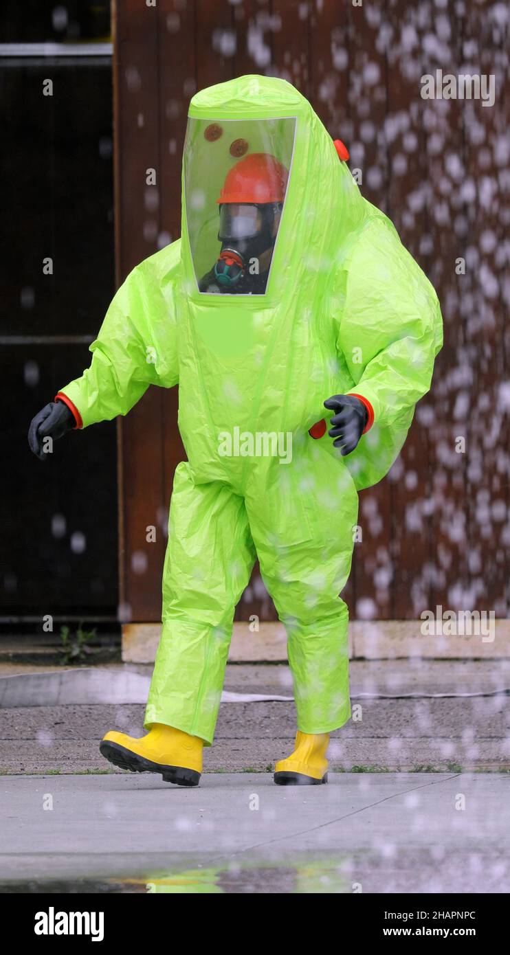 protected person with industrial yellow protective suit against ...