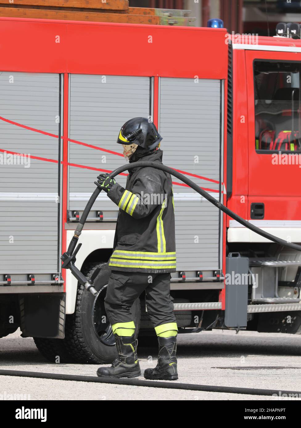 firefighter of the Italian fire brigade during the maneuver with the ...