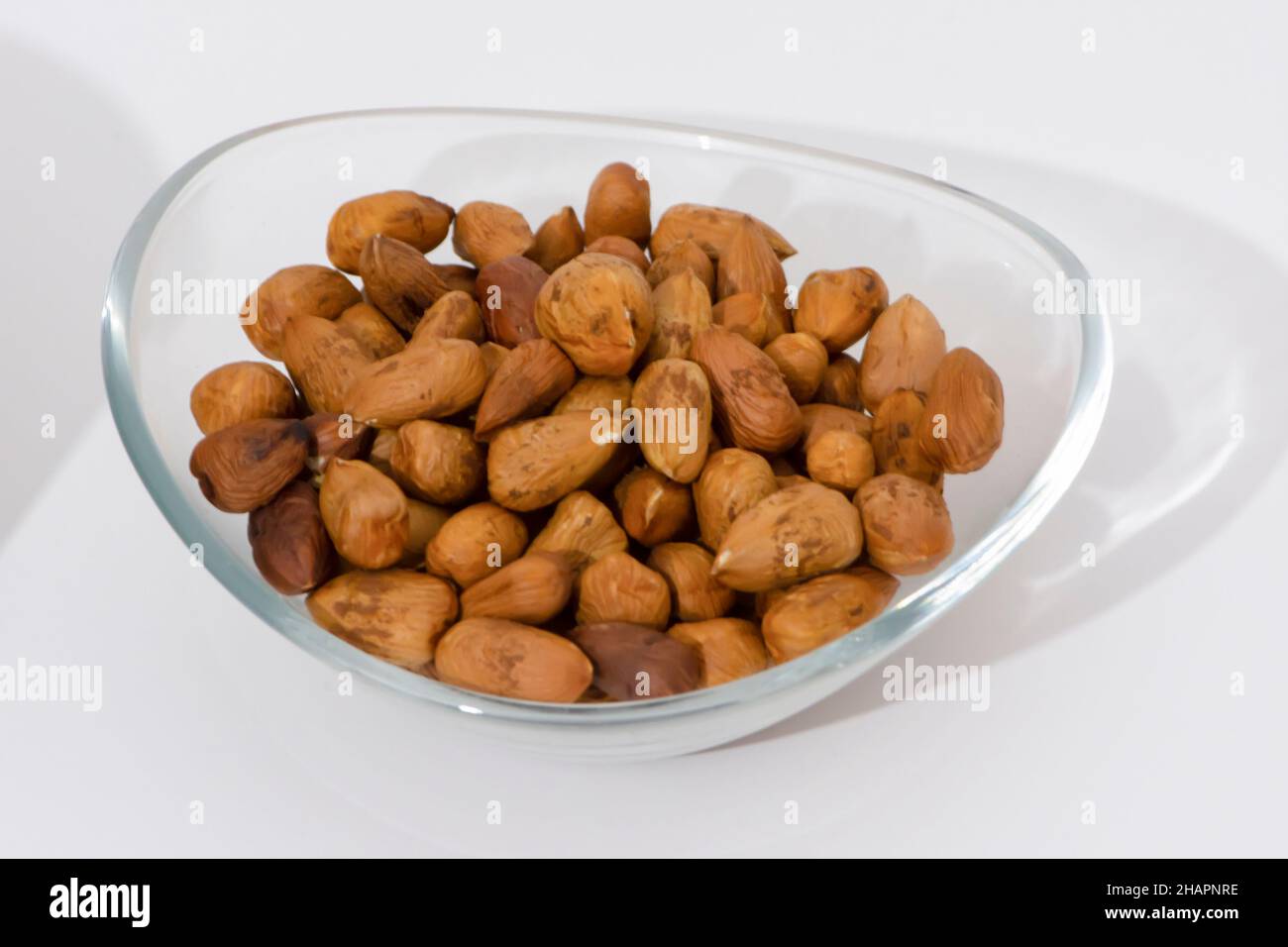 Hazel or hazelnuts in a glass bowl isolated on white background Stock ...