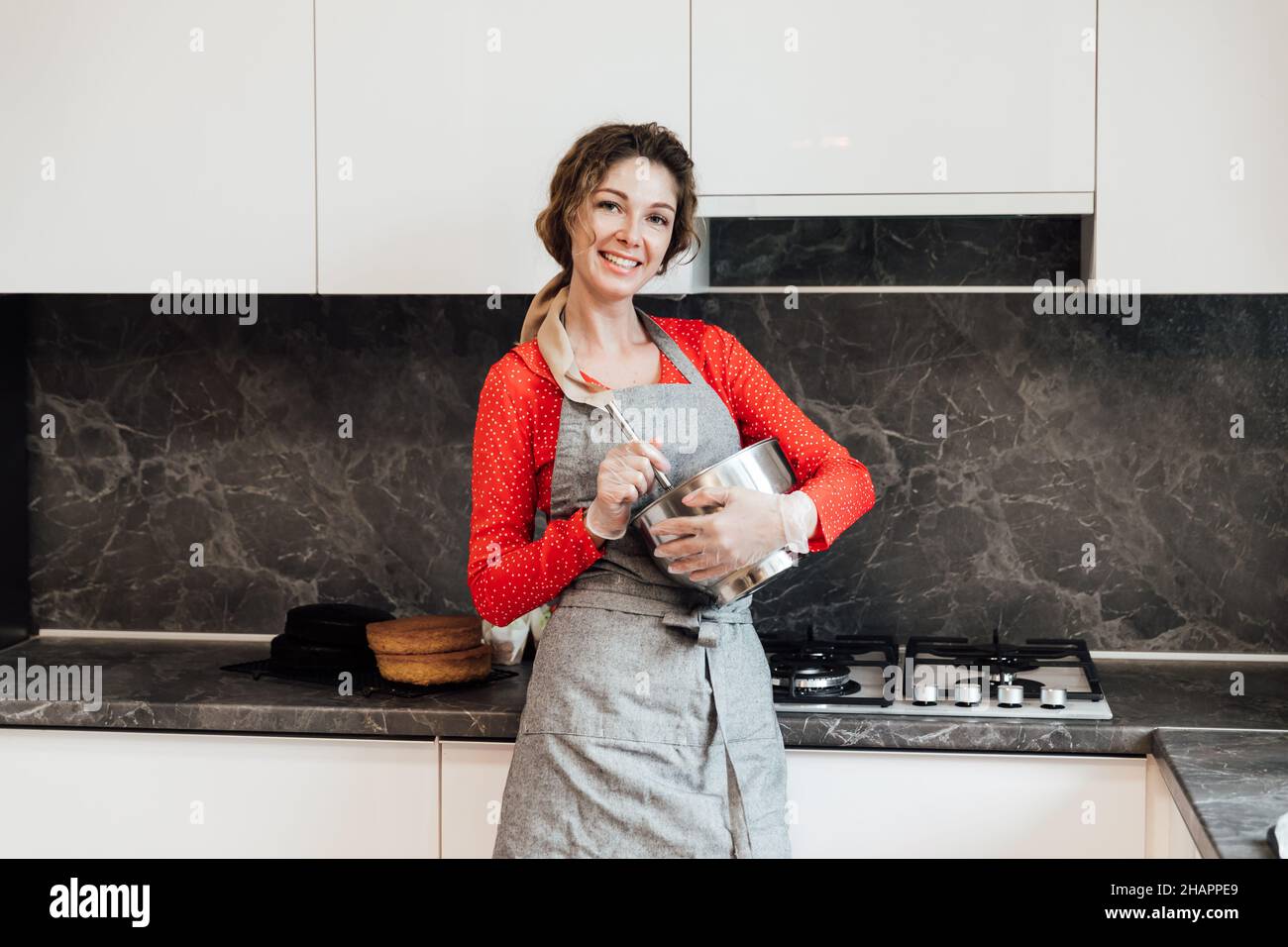 beautiful woman cooks sweet dessert in the kitchen Stock Photo - Alamy