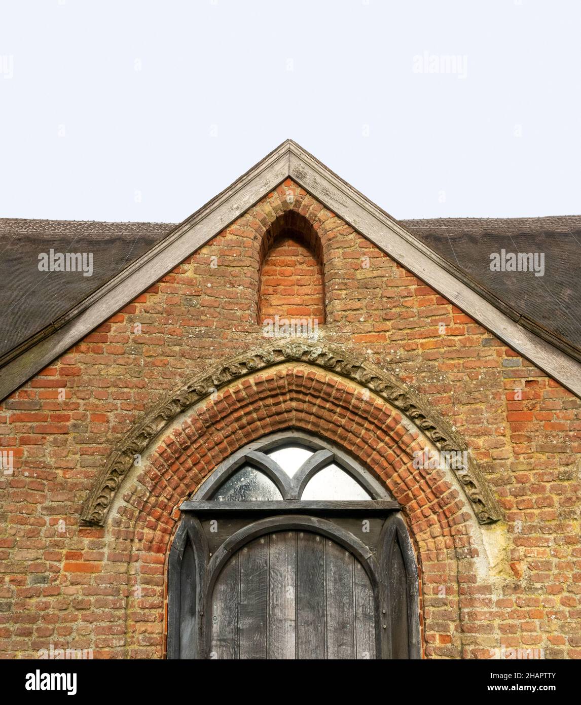 The top section of the porch front and doorway of Church of St John the ...