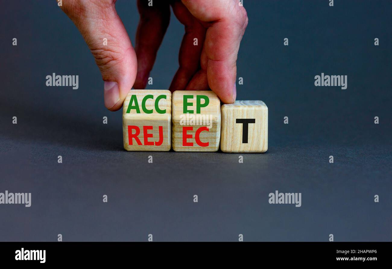 Accept or reject symbol. Businessman turns wooden cubes and changes the ...