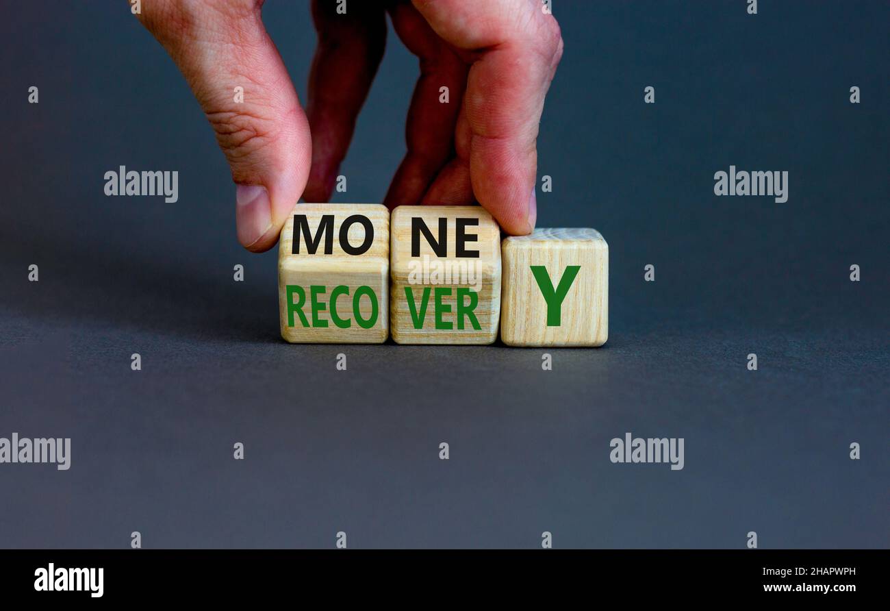 Money recovery symbol. Businessman turns wooden cubes and changes the ...