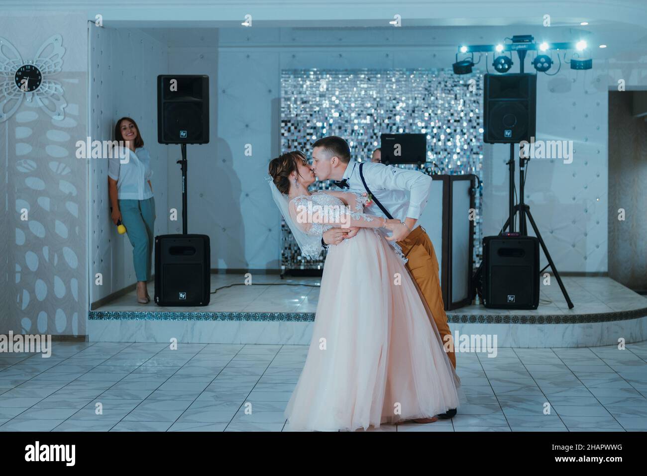 beautiful caucasian couple just married and dancing their first dance ...