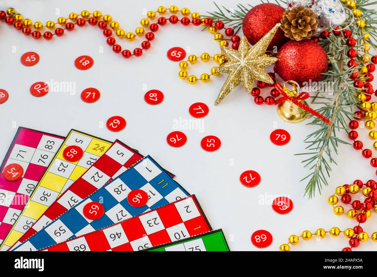 Colorful bingo game cards and numbers on white background with ...