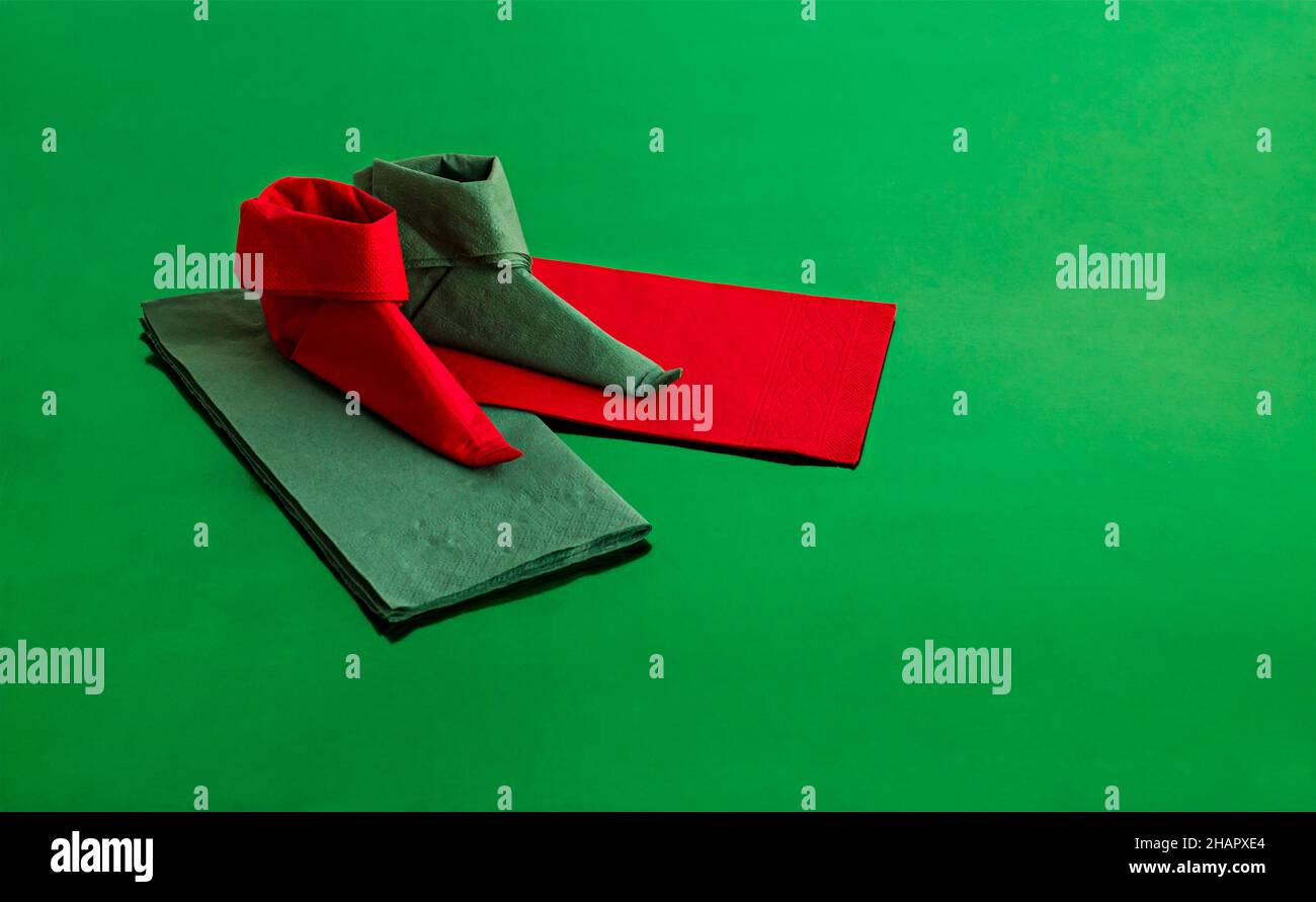 Green And Red Color,Paper Napkin Folded In The Shape of little elf ...