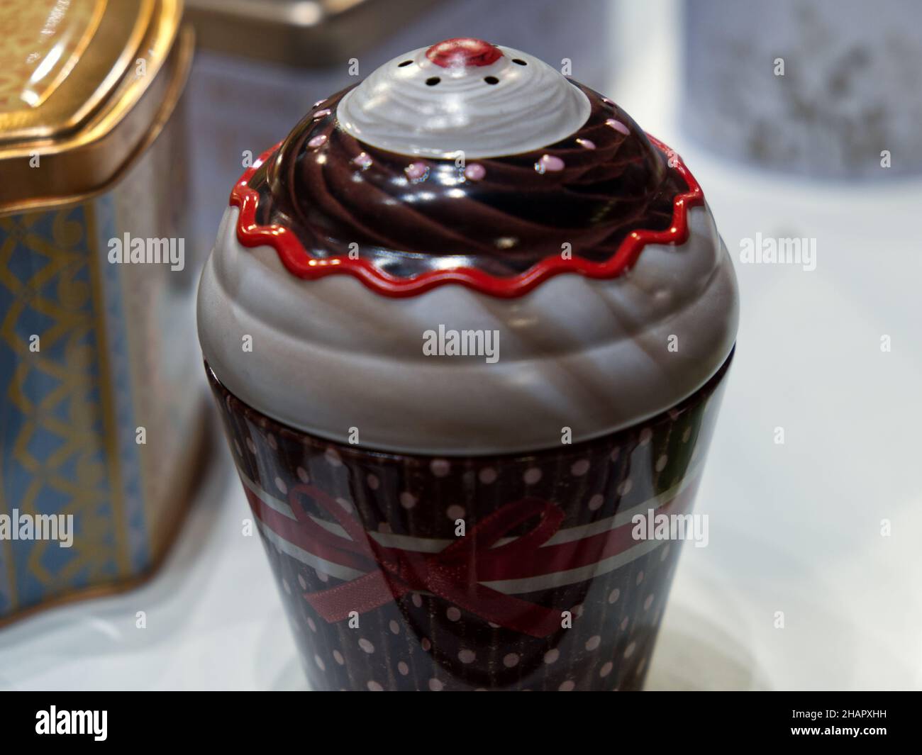 a tin container for candy and chocolates painted to resemble a ...