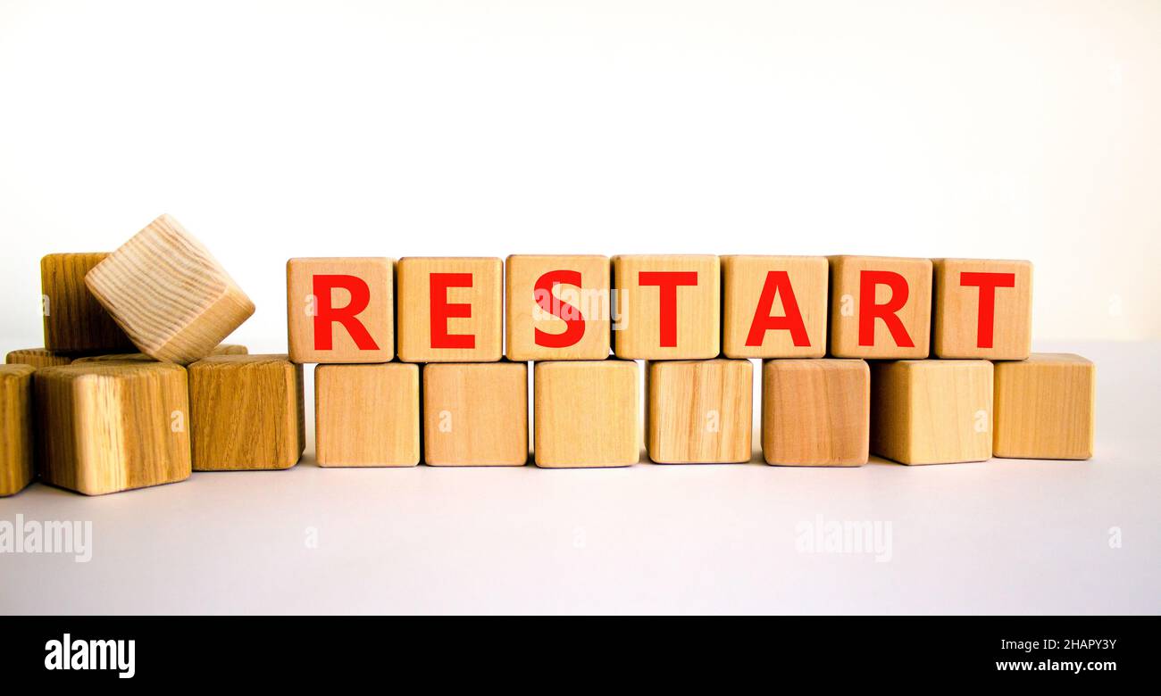 Restart and start symbol. The concept word Restart on wooden cubes ...