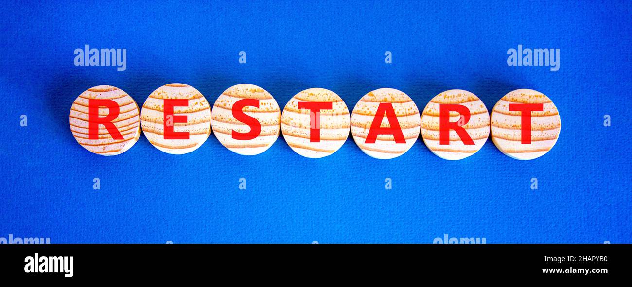 Restart and start symbol. The concept word Restart on wooden circles ...