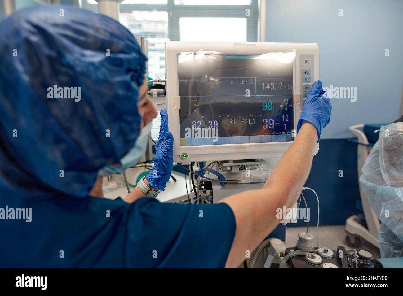 surgeon keeping track of vital functions of the body during cardiac ...