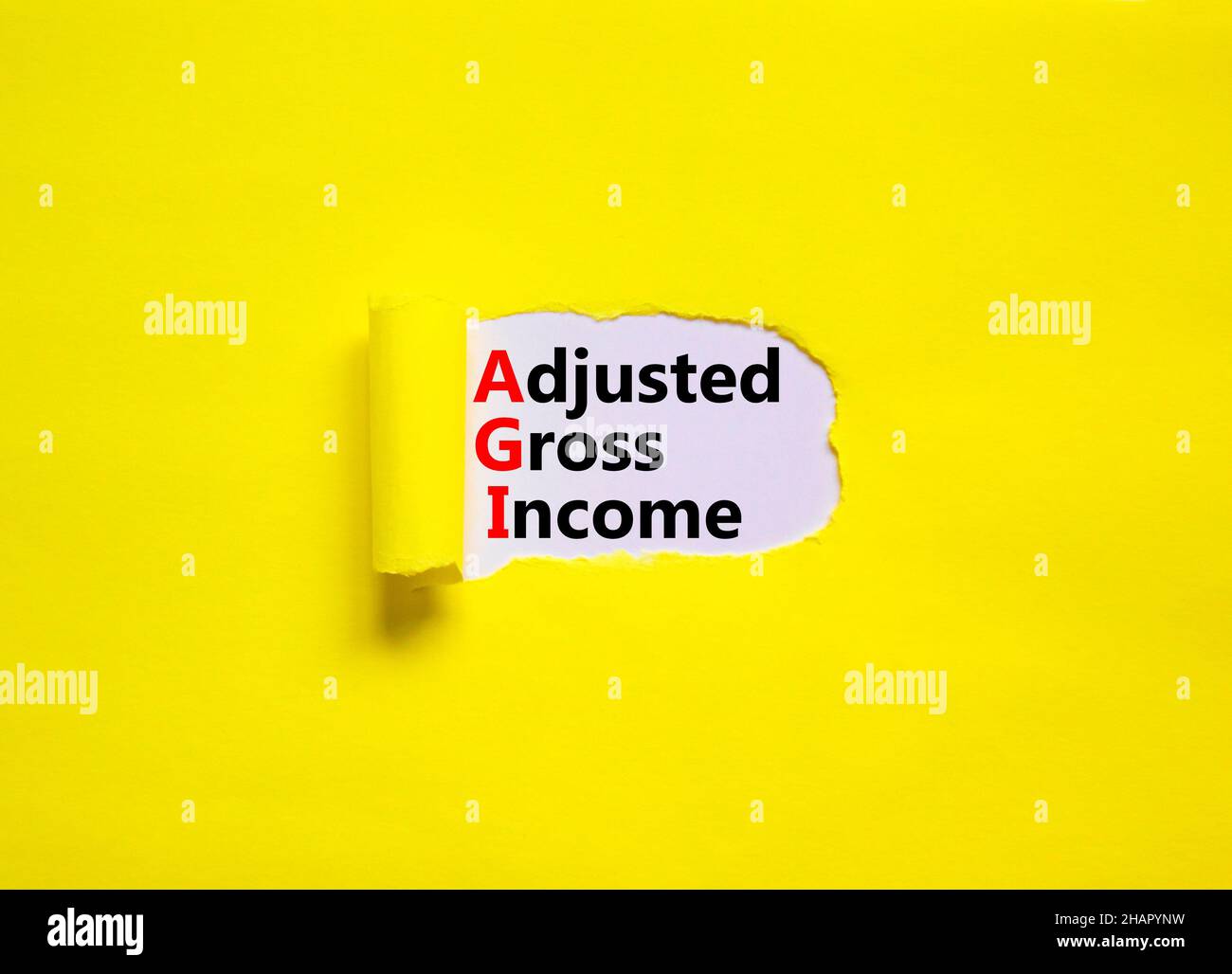 AGI adjusted gross income symbol. Concept words AGI adjusted gross ...