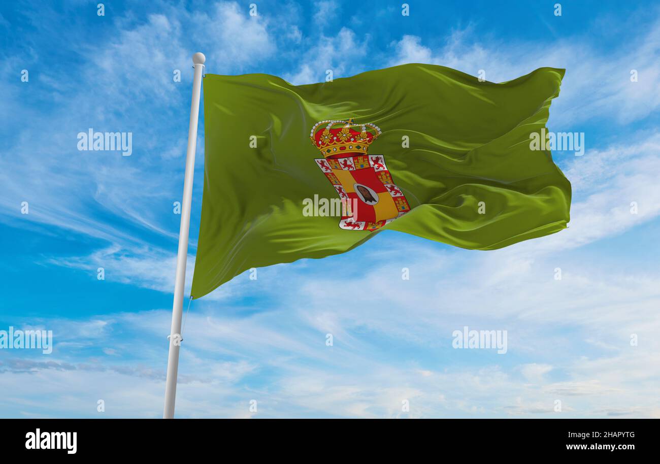 flag of Jaen , Spain at cloudy sky background on sunset, panoramic view ...