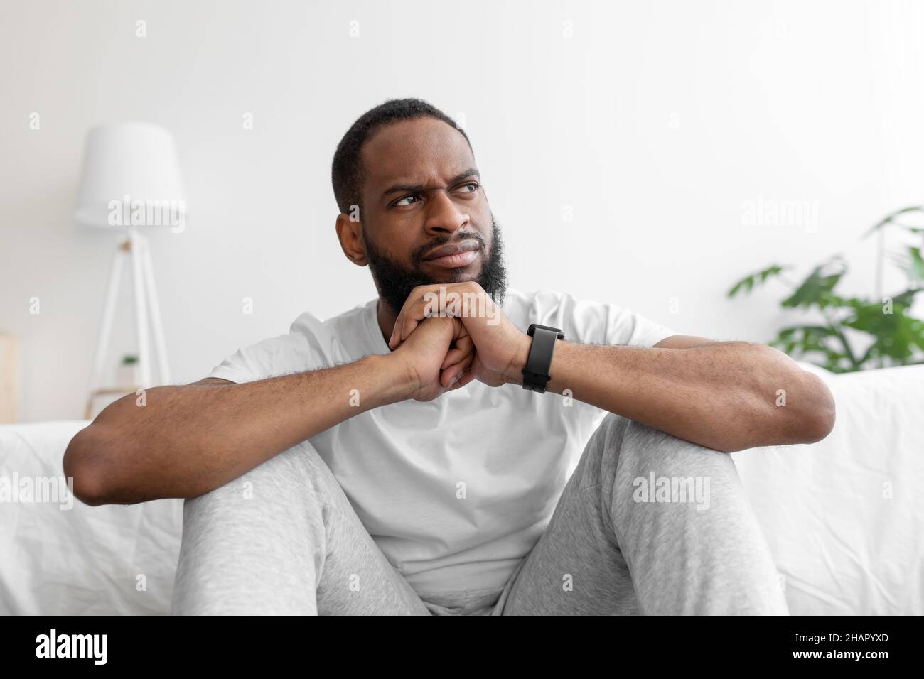 Sad man sitting on floor hi-res stock photography and images - Alamy
