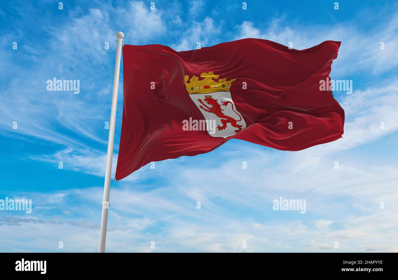 flag of Leon , Spain at cloudy sky background on sunset, panoramic view ...