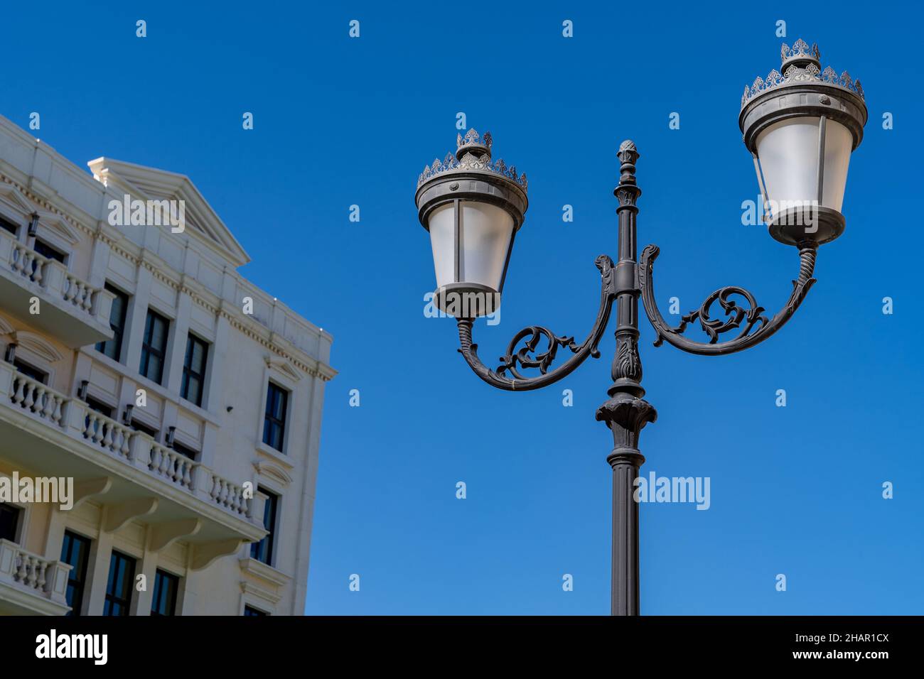 View of a street lamp with a building in the background in Pearl-Qatar ...