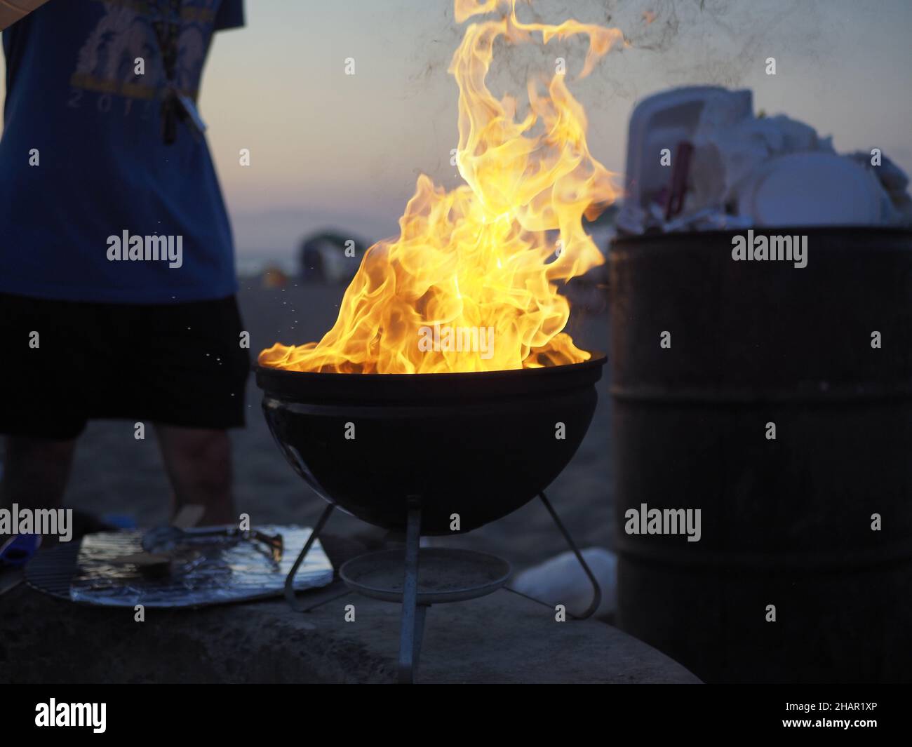 Flames of the bonfire in a bowl near the garbage bin Stock Photo - Alamy