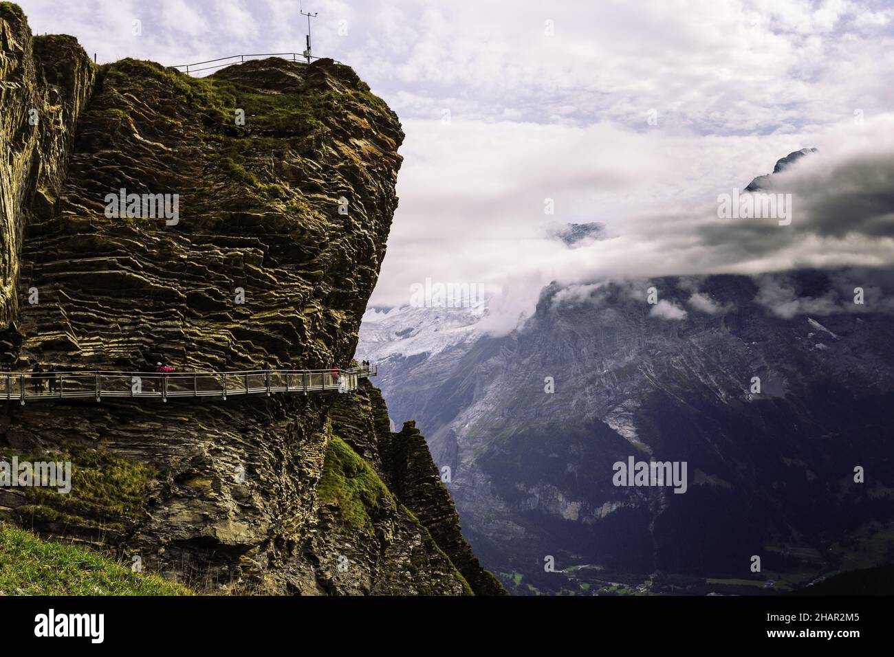 Pathway on the edge of a lofty mountain on a cloudy morning Stock Photo ...