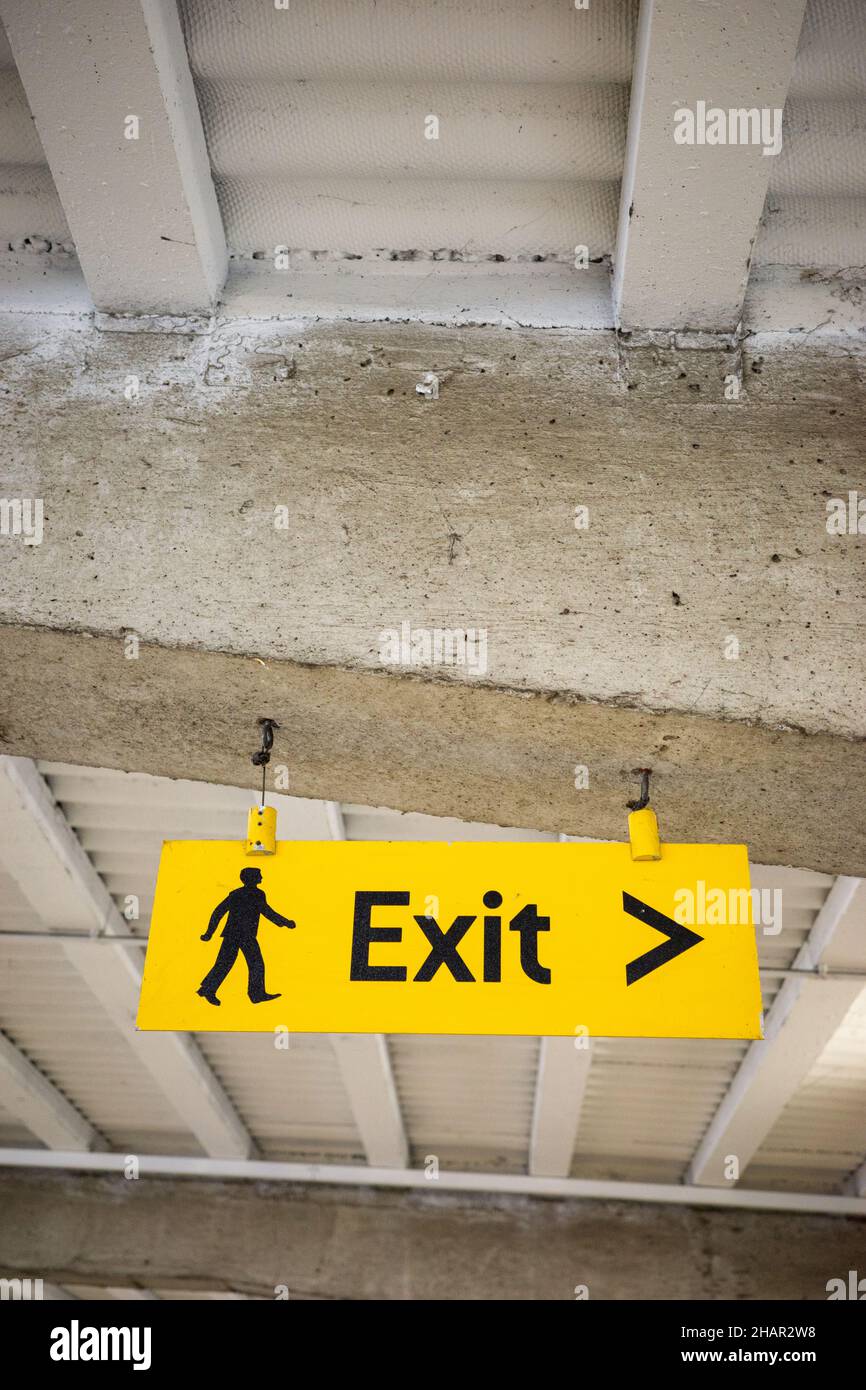 Yellow exit sign in a car park Stock Photo - Alamy