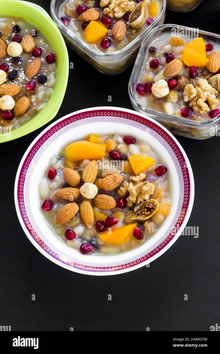 Traditional Turkish Dessert Asure or Noah's Ark Pudding on black ...