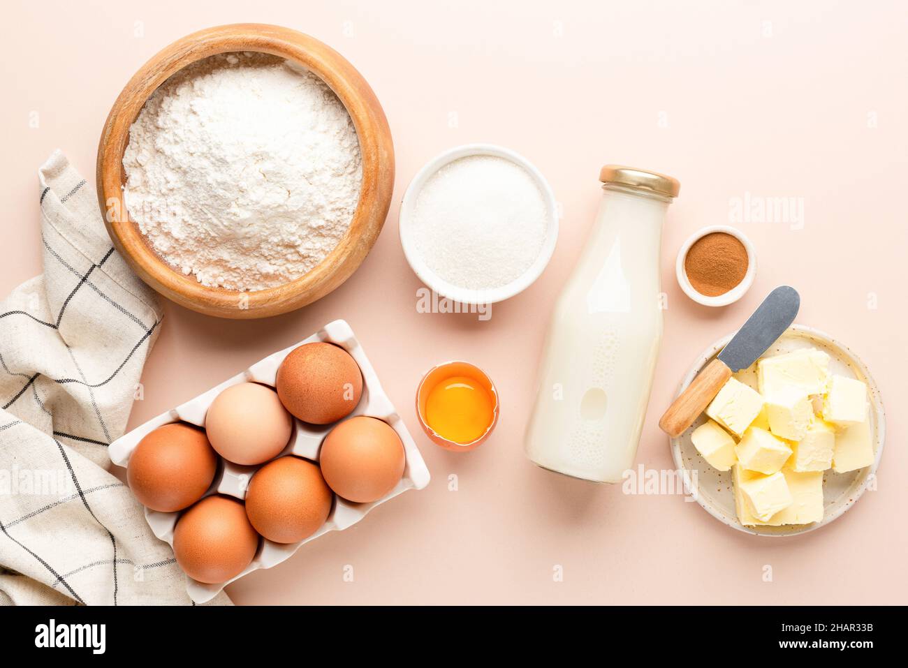Baking background on beige pink background, flat lay. Sweet bread ...
