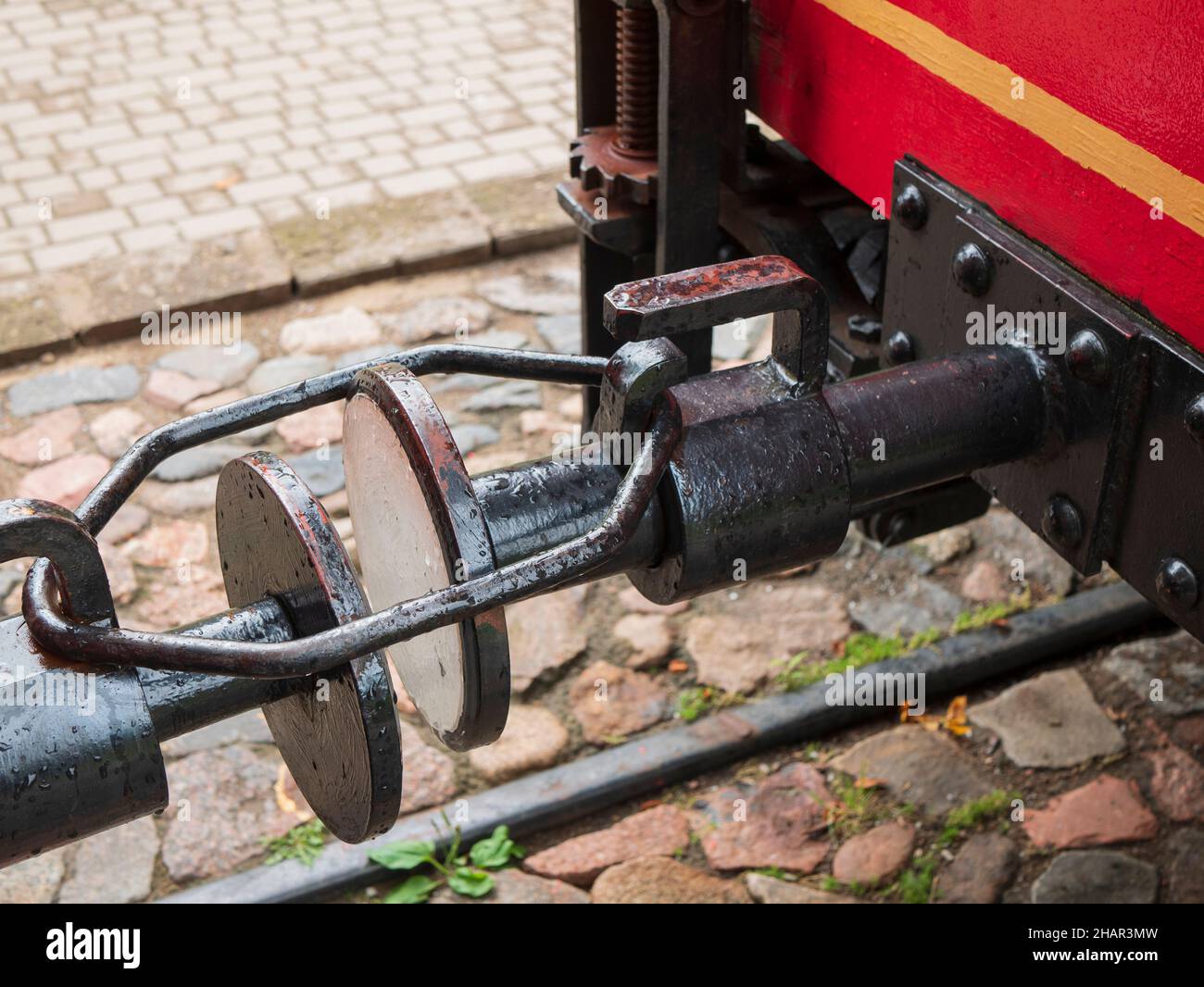Old tram coupling on the background of cobblestone. Type of connection ...