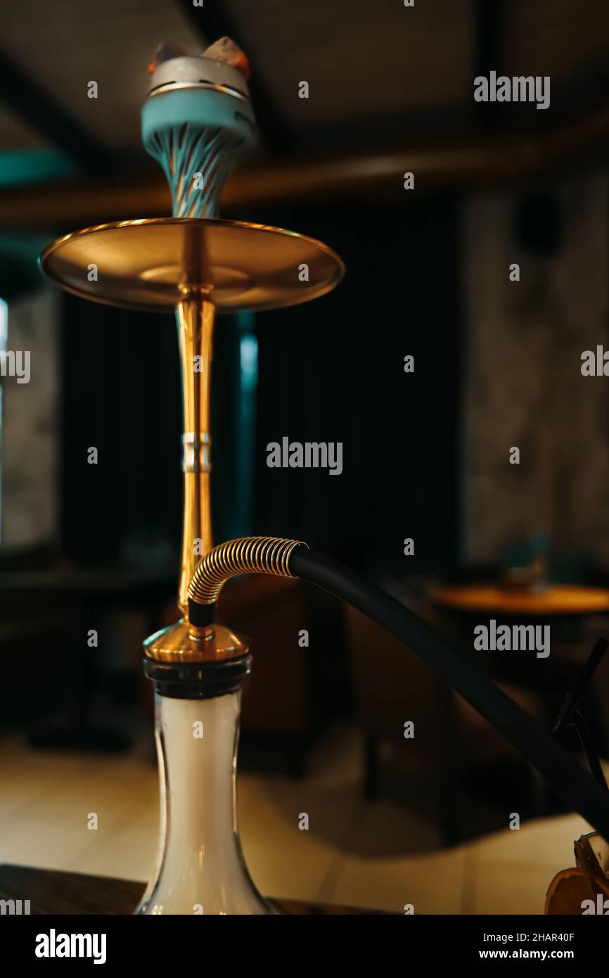 Gold hookah on table in lounge cafe Stock Photo - Alamy