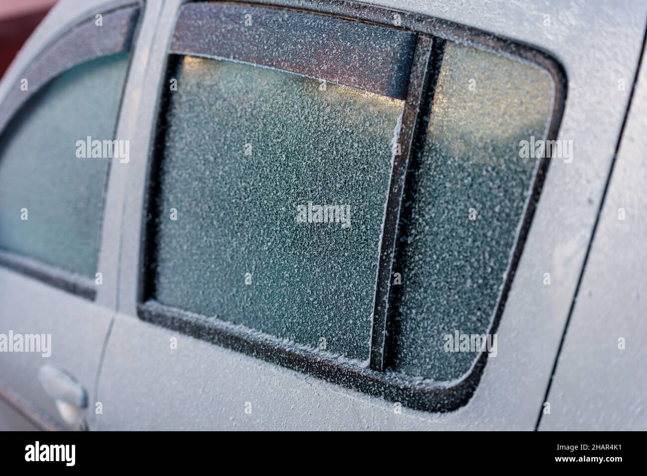 frost covered white car side windows with plastic deflectors - close-up ...