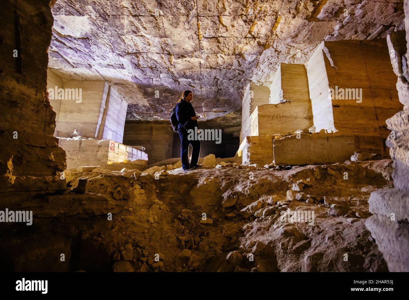 Urban explorer in old abandoned limestone mine Stock Photo - Alamy