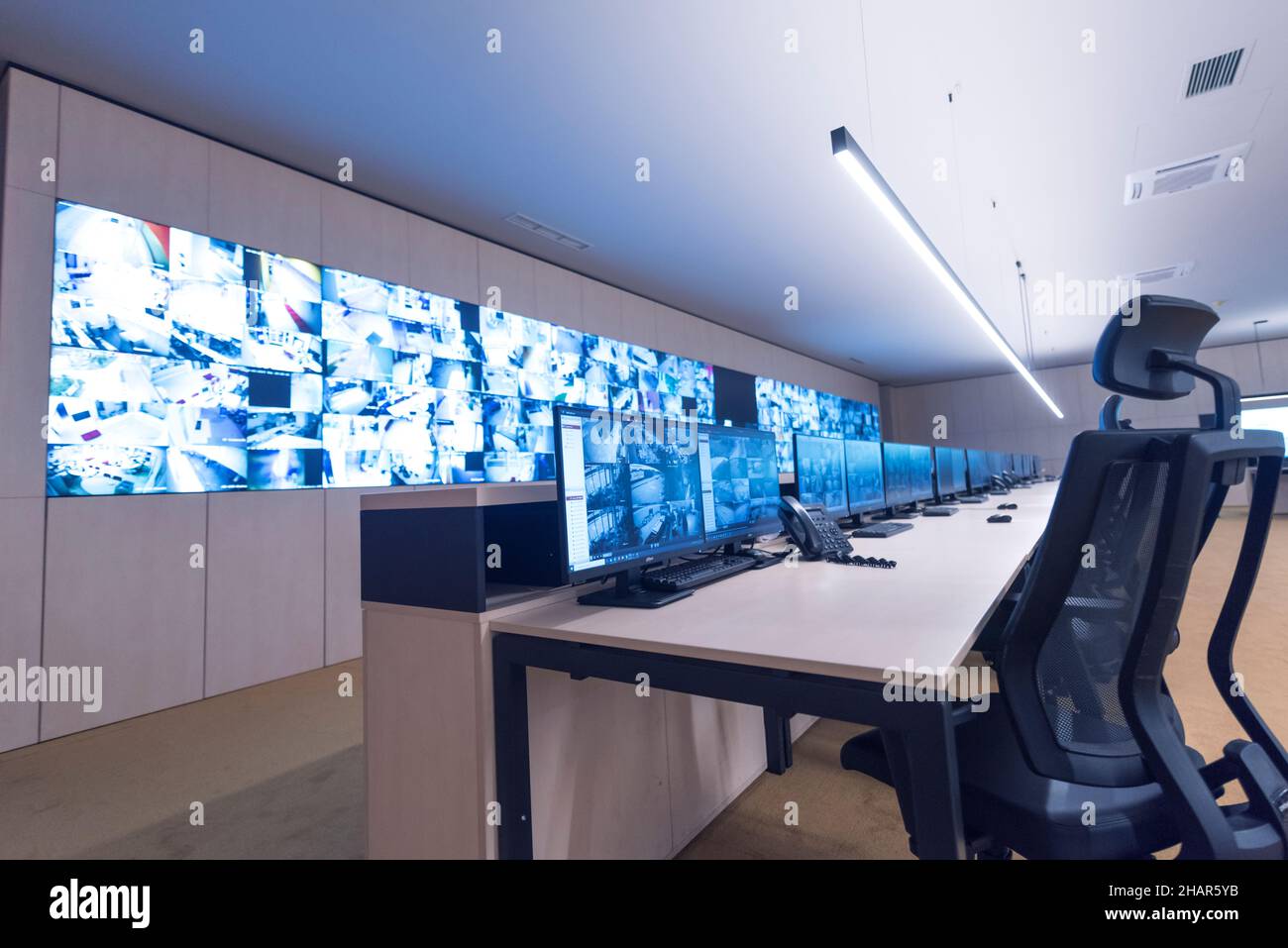 Security guard monitoring modern CCTV cameras in surveillance room ...
