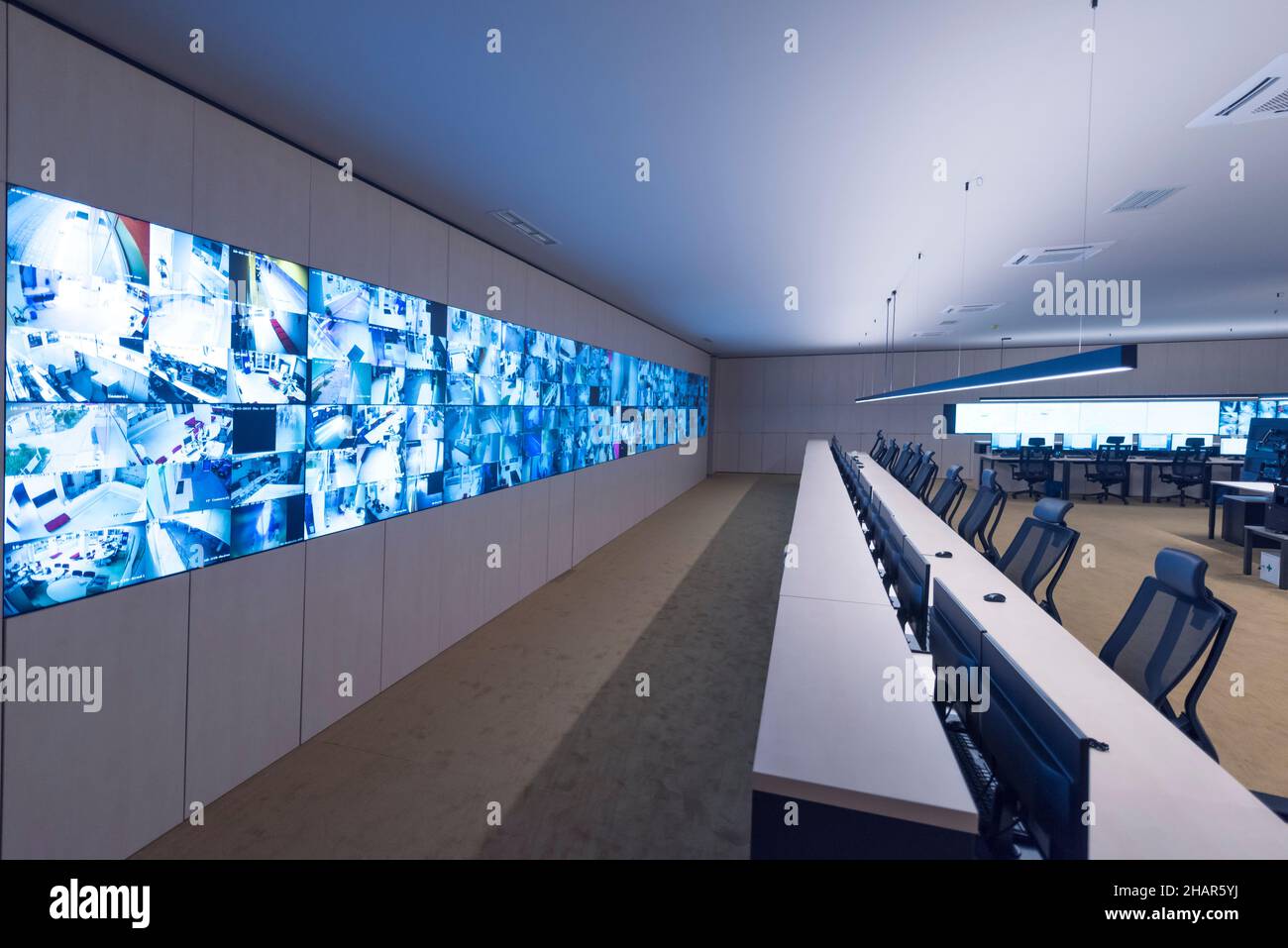 Security guard monitoring modern CCTV cameras in surveillance room ...
