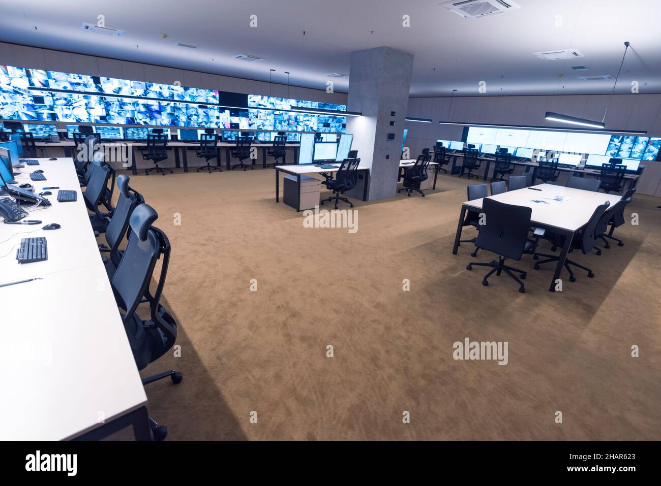 Security guard monitoring modern CCTV cameras in surveillance room ...